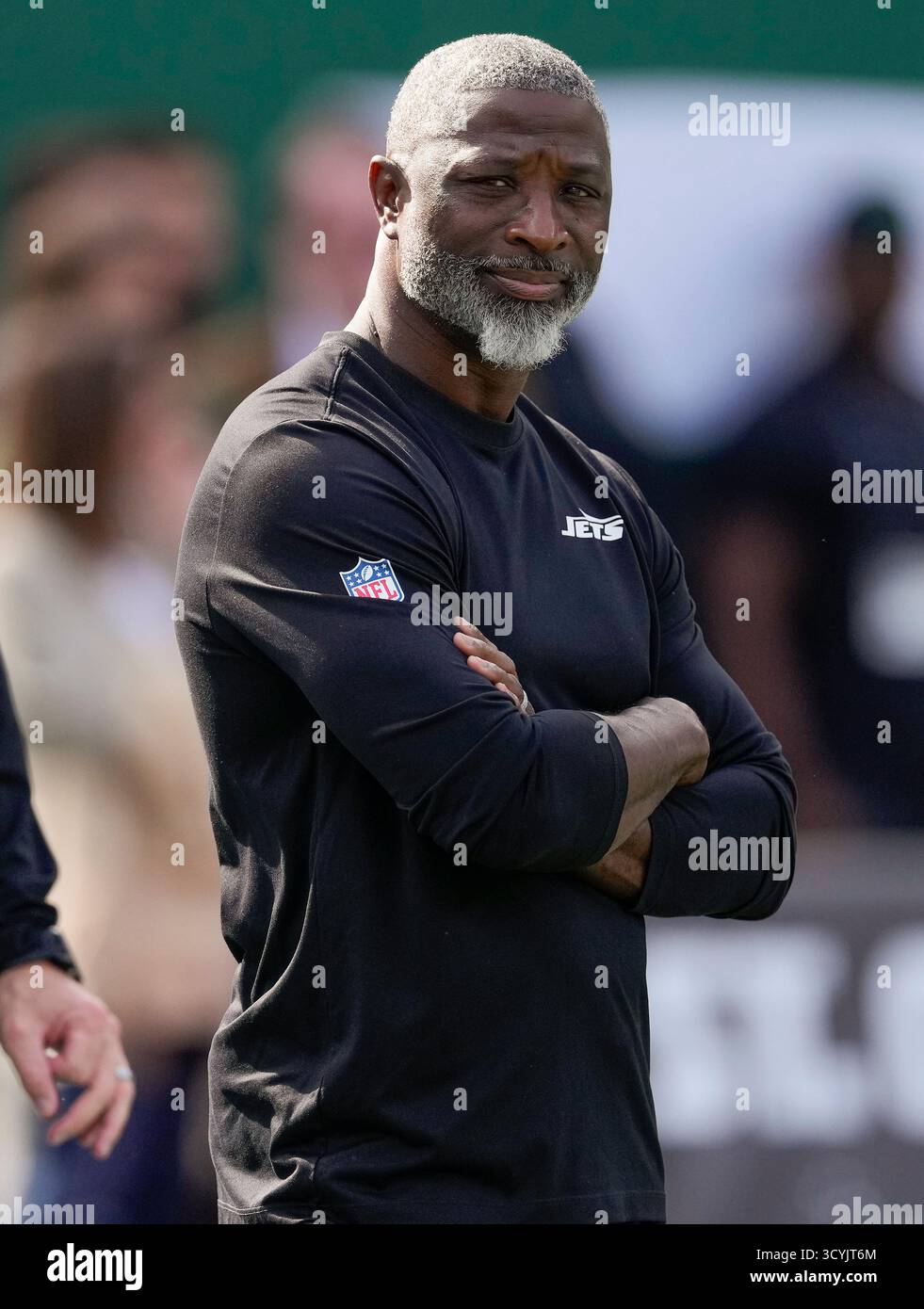 New York Jets head coach Aaron Glenn walks on the field before an NFL ...