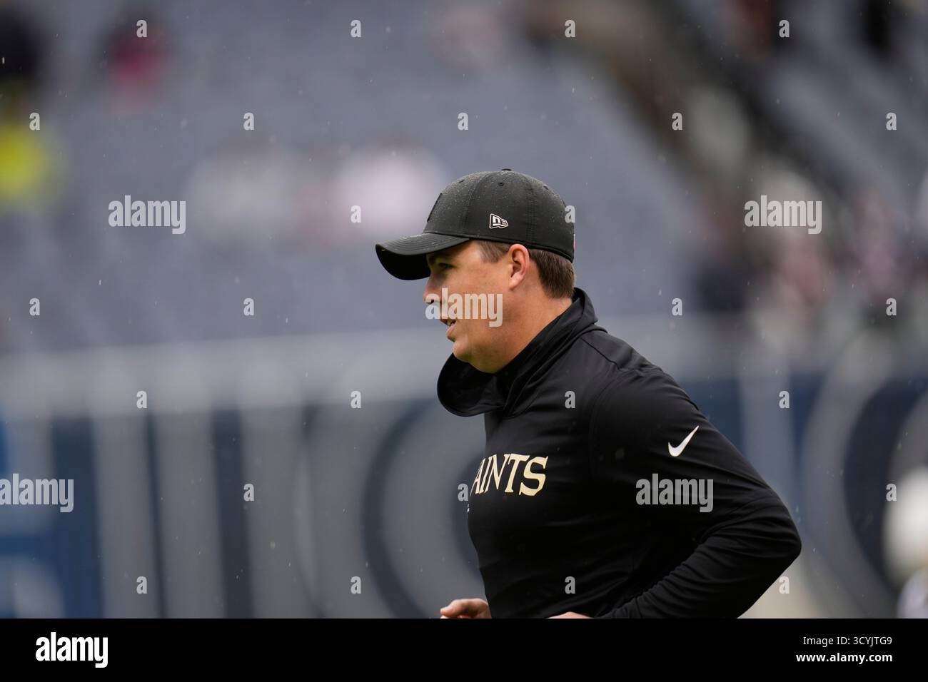 New Orleans Saints head coach Kellen Moore runs on the field before an ...