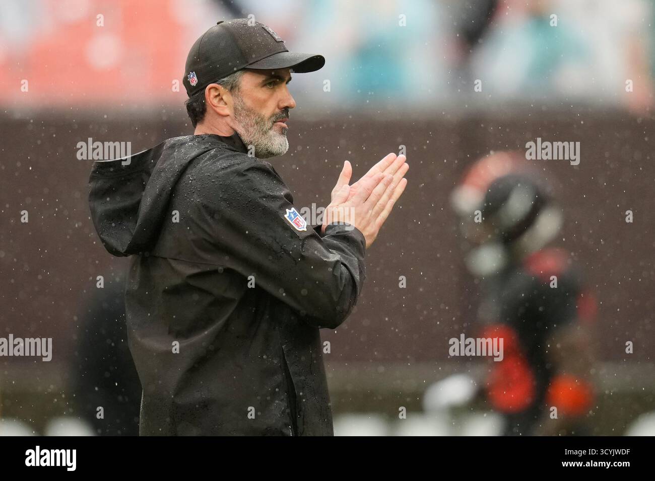 Cleveland Browns head coach Kevin Stefanski watches as his team warms ...