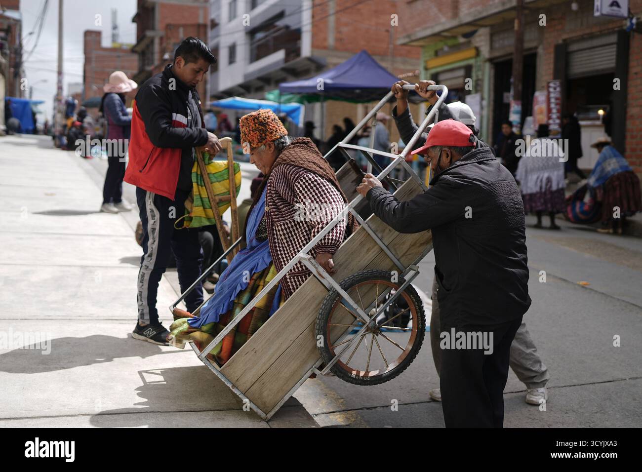 A woman arrives to a polling station to vote in a presidential runoff ...