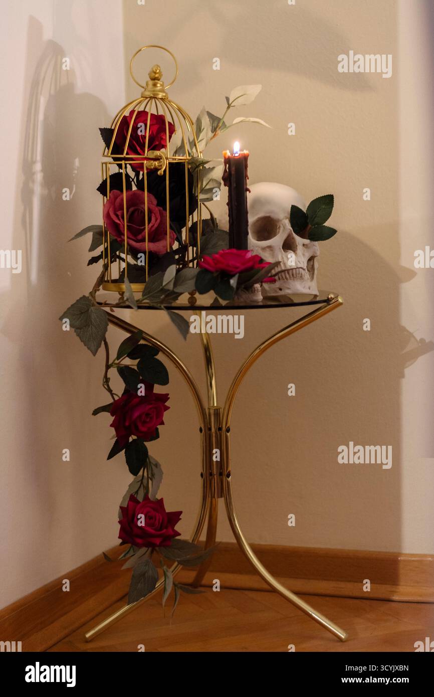 Halloween gothic decoration with red roses in a birdcage Stock Photo ...