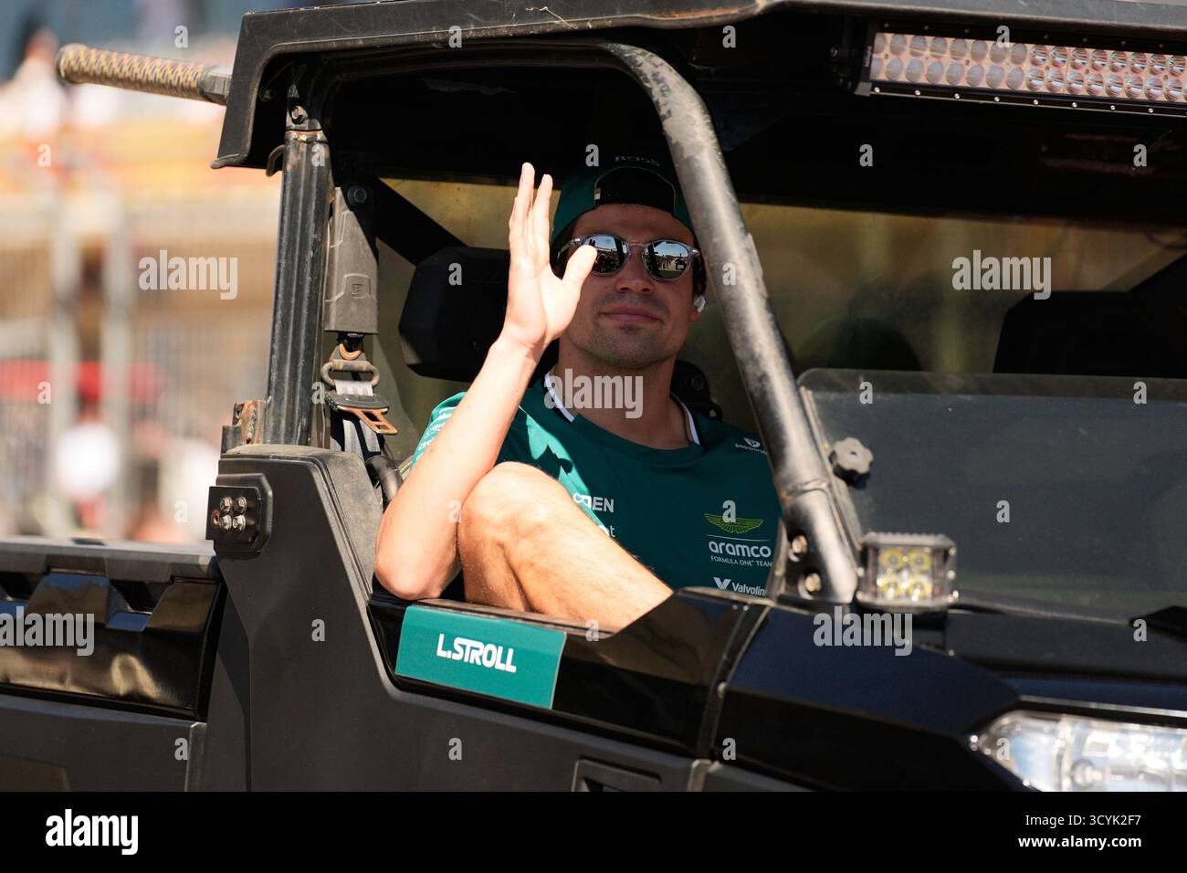 Aston Martin driver Lance Stroll of Canada arrives in the paddock prior ...