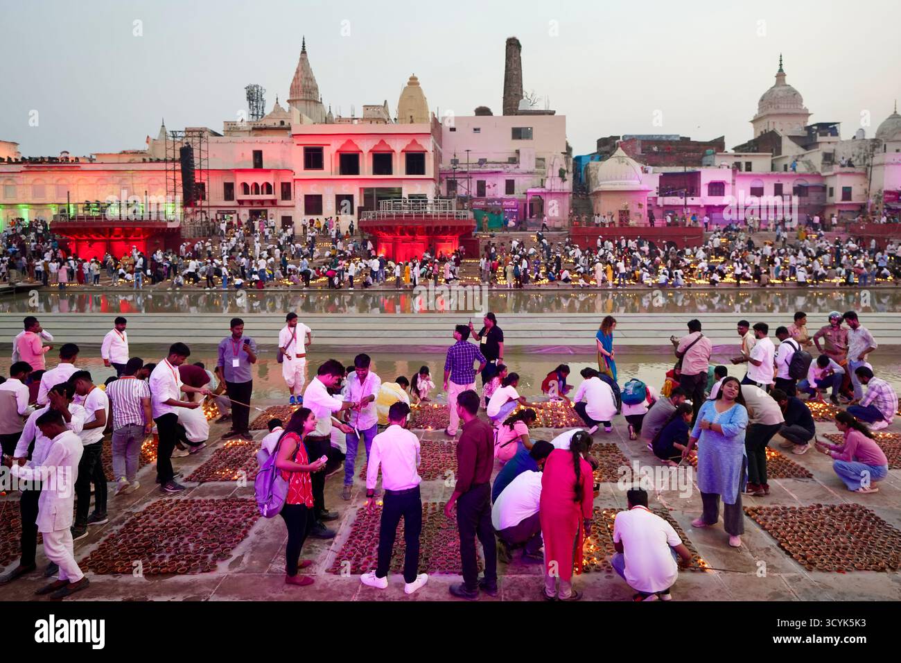 Hindu devotees light oil lamps along the Saryu river during Deepotsav ...
