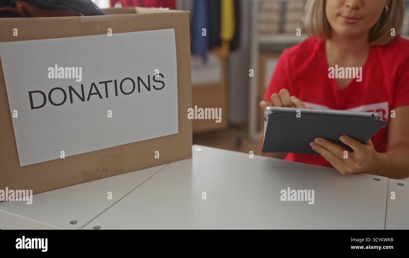 Blonde woman taps tablet hi-res stock photography and images - Alamy