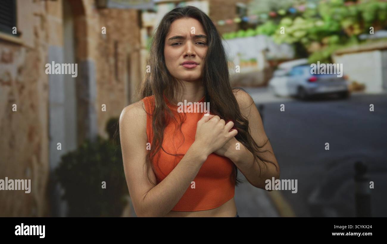 Woman pressing hands clutch chest hi-res stock photography and images ...