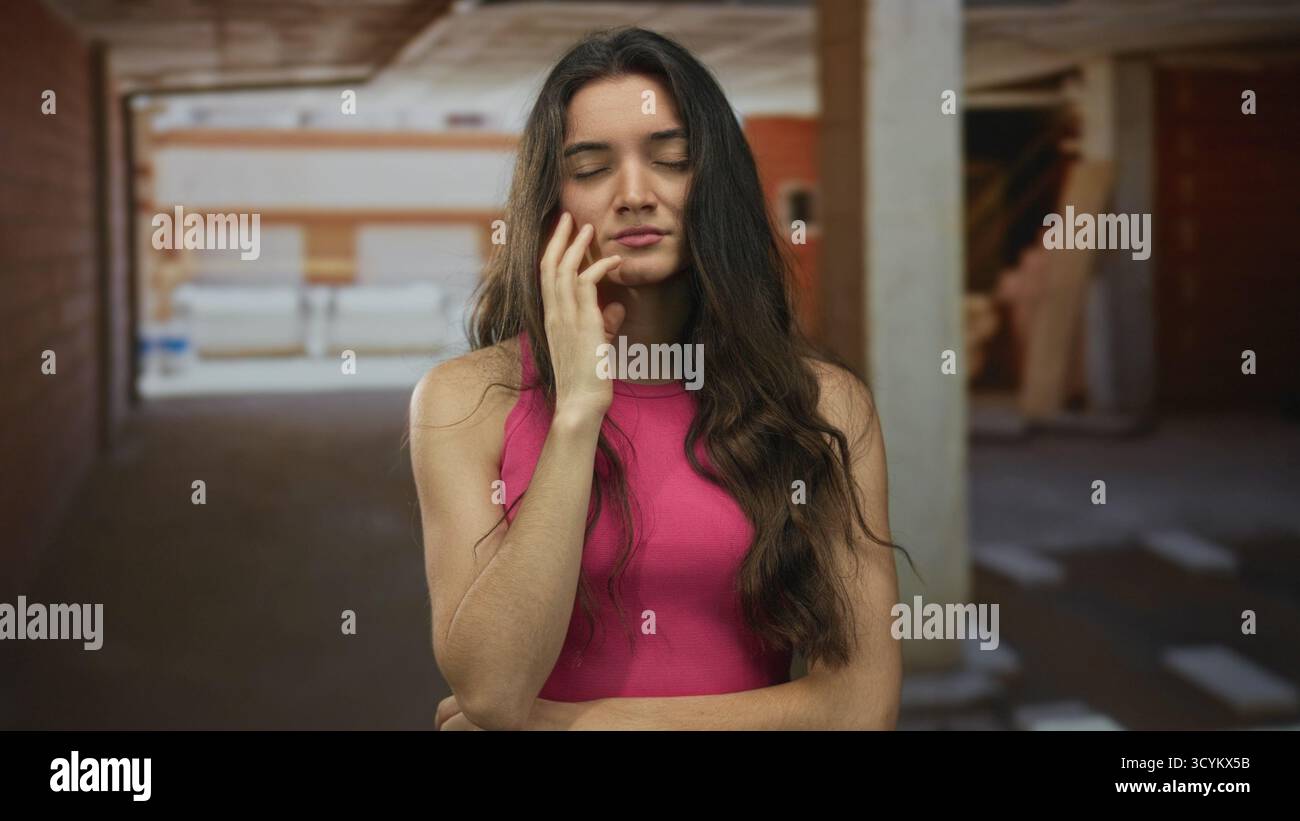 Teenage woman touching cheek hi-res stock photography and images - Alamy