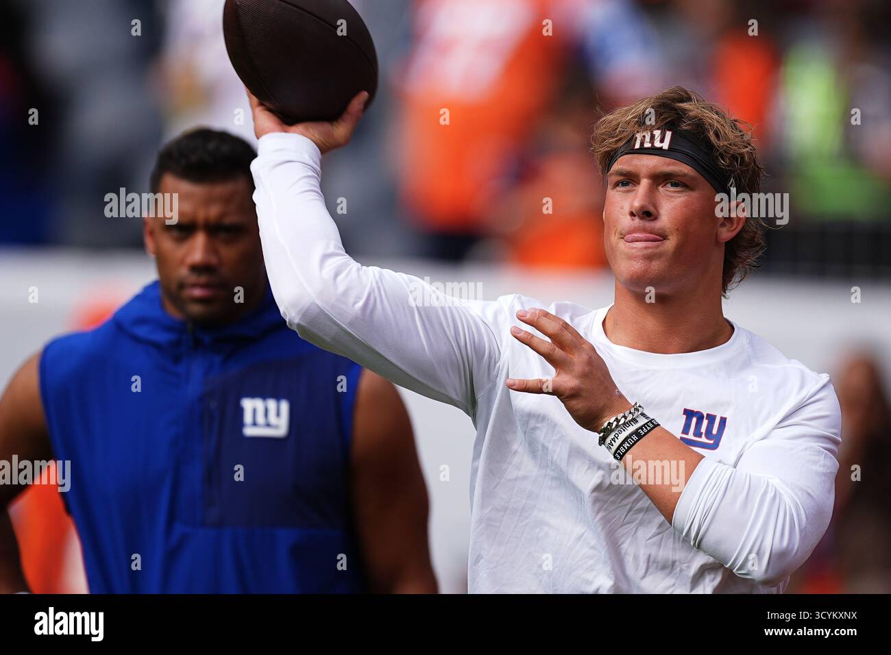 New York Giants quarterback Russell Wilson, left, watches as ...