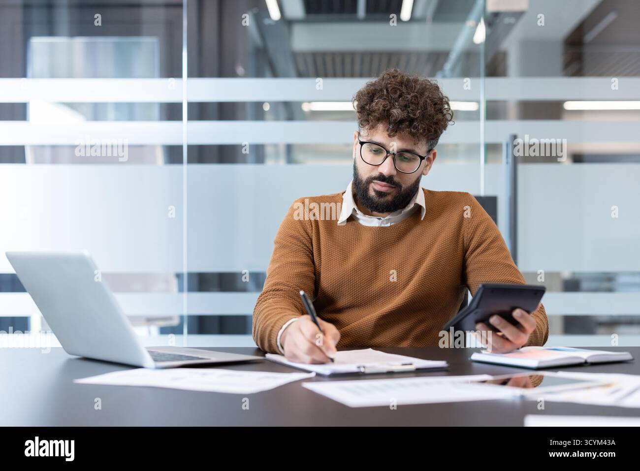 Young diligent employee glasses hi-res stock photography and images - Alamy