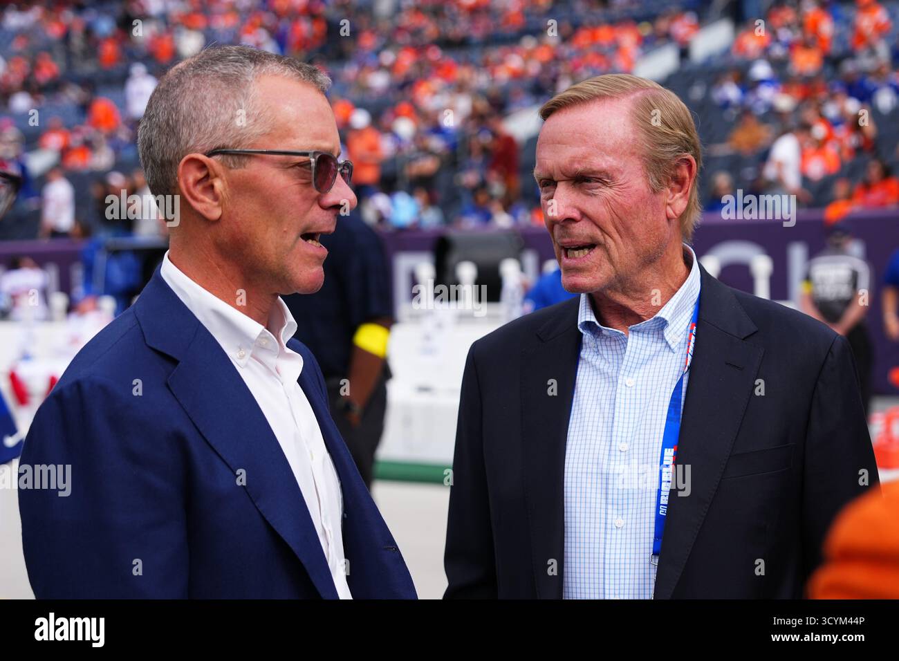 Denver Broncos owner and chief executive officer Greg Penner, left ...