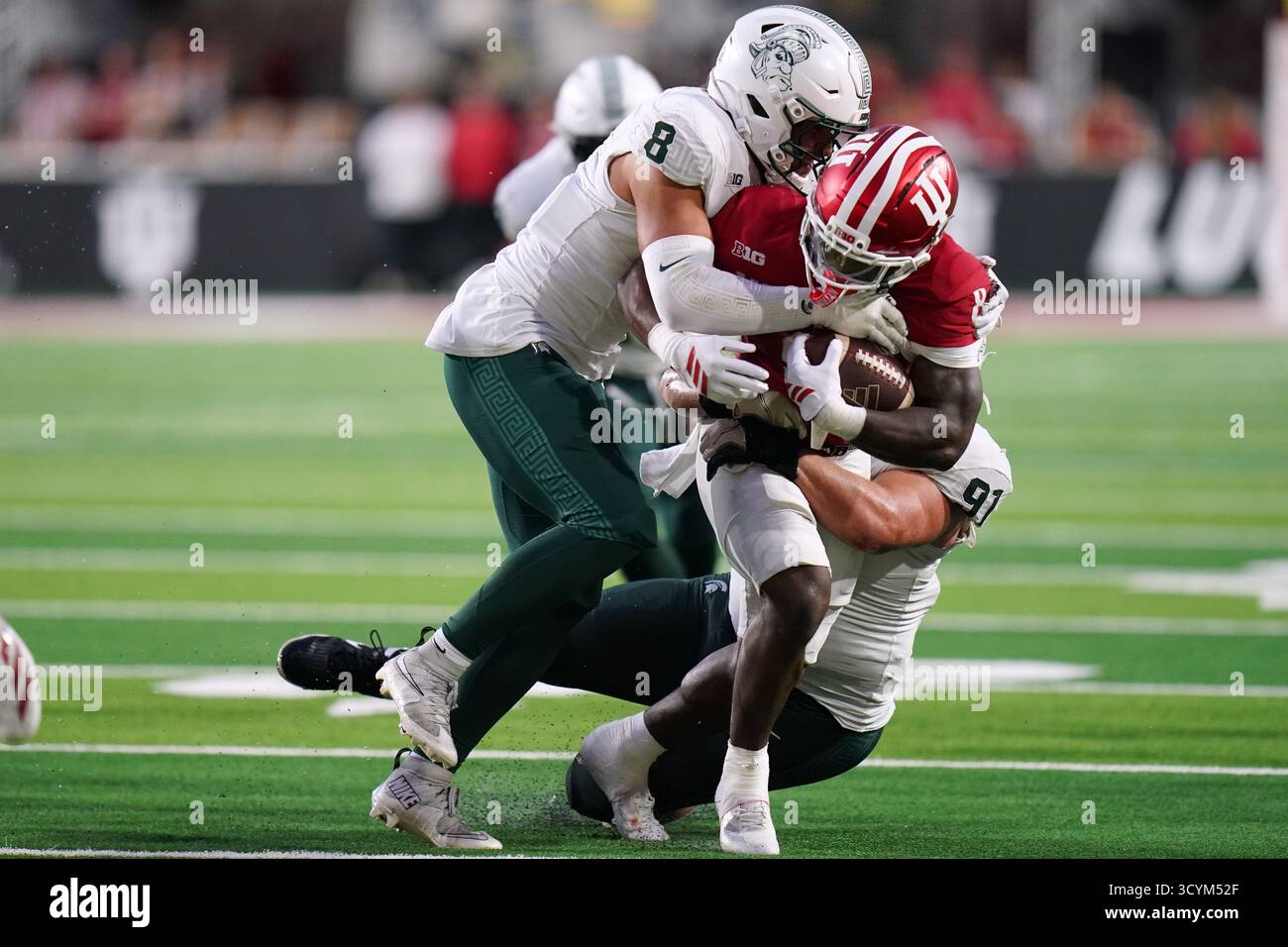Indiana running back Kaelon Black (8) gets tackled by Michigan State ...