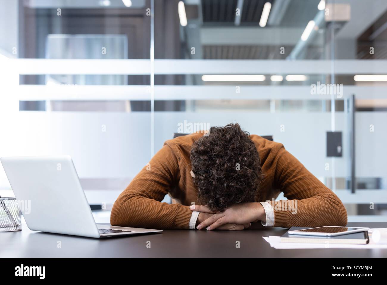Stressed man experiencing professional burnout and overwork, resting ...
