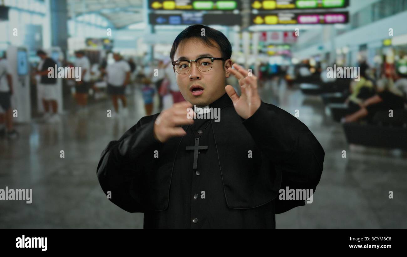 Chinese priest in bustling airport hi-res stock photography and images ...