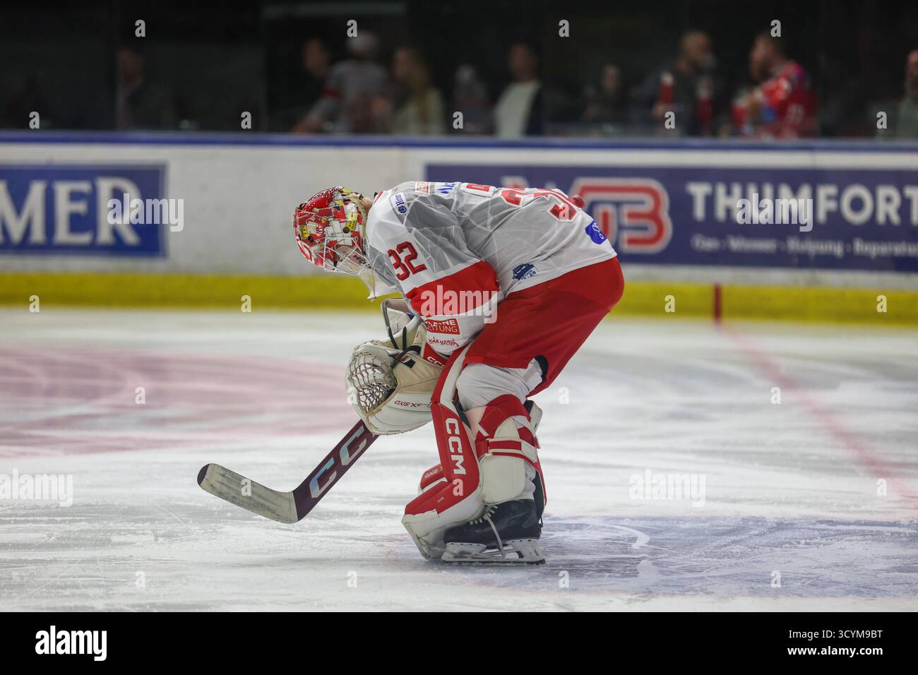 ICE Hockey League match between Graz 99ers and EC KAC in Austria. Intense game moments, players ...