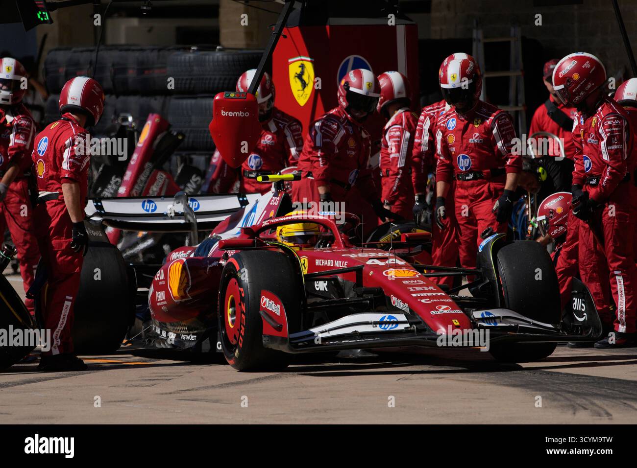 Ferrari driver Lewis Hamilton of Britain makes a pit stop during the ...
