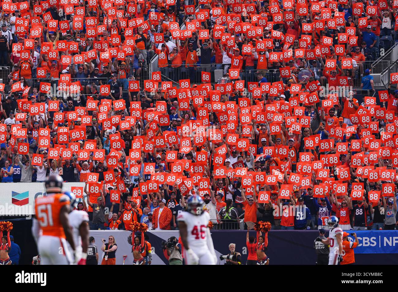 Fans hold up signs for former Denver Broncos wide receiver Demaryius ...