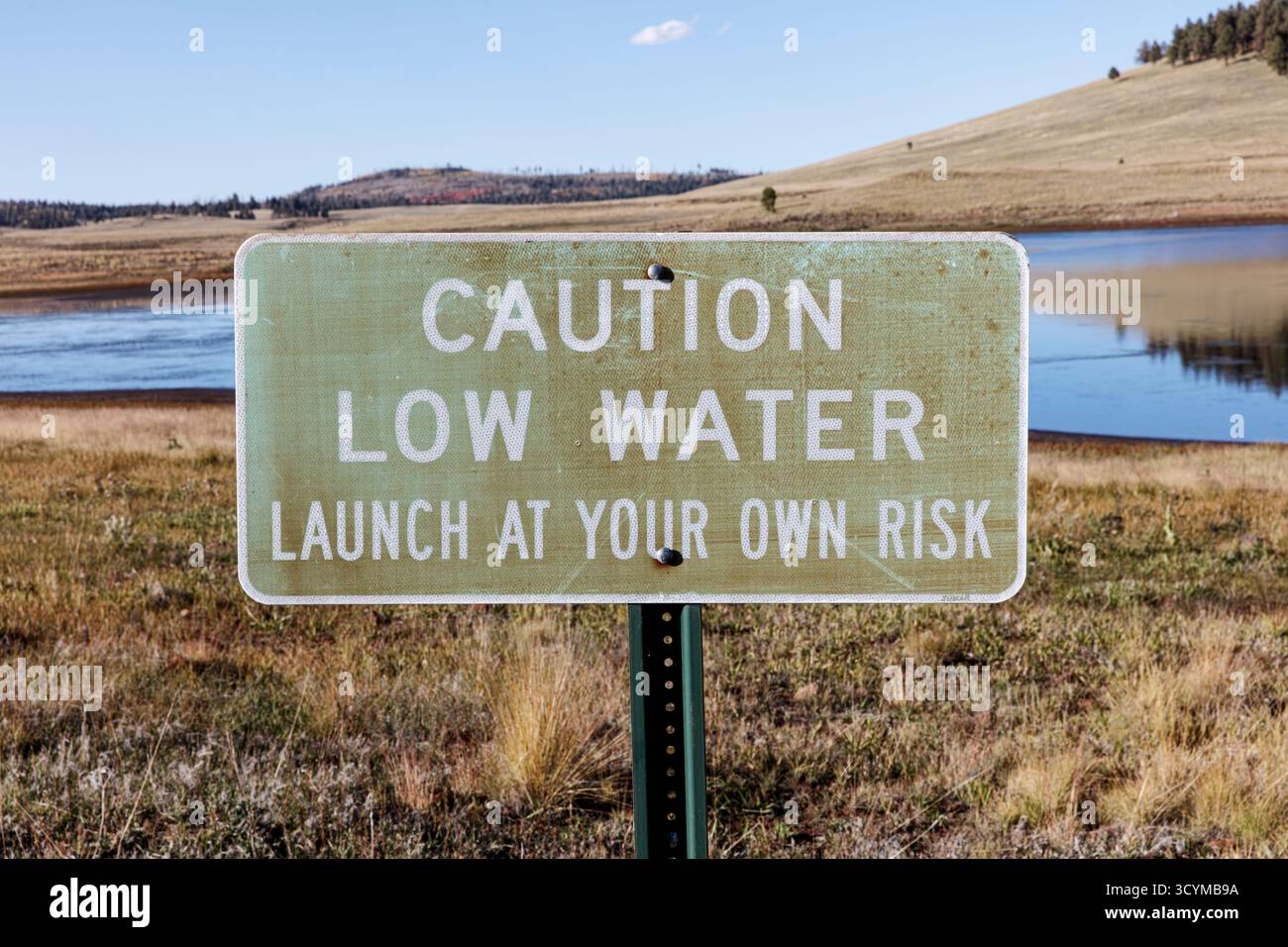 Low water on lake, boat launch warning sign, White Mountains, Greer ...