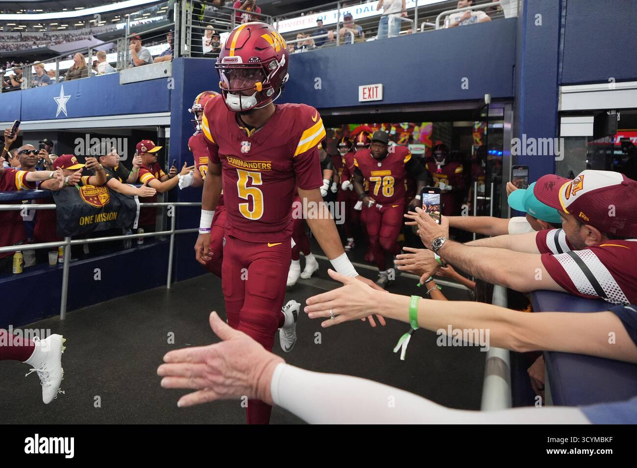 Washington Commanders quarterback Jayden Daniels greets supporters ...