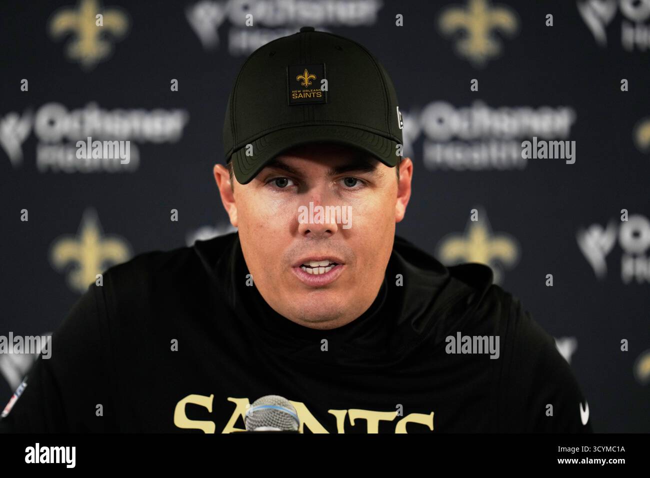 New Orleans Saints head coach Kellen Moore talks to reporters after an ...