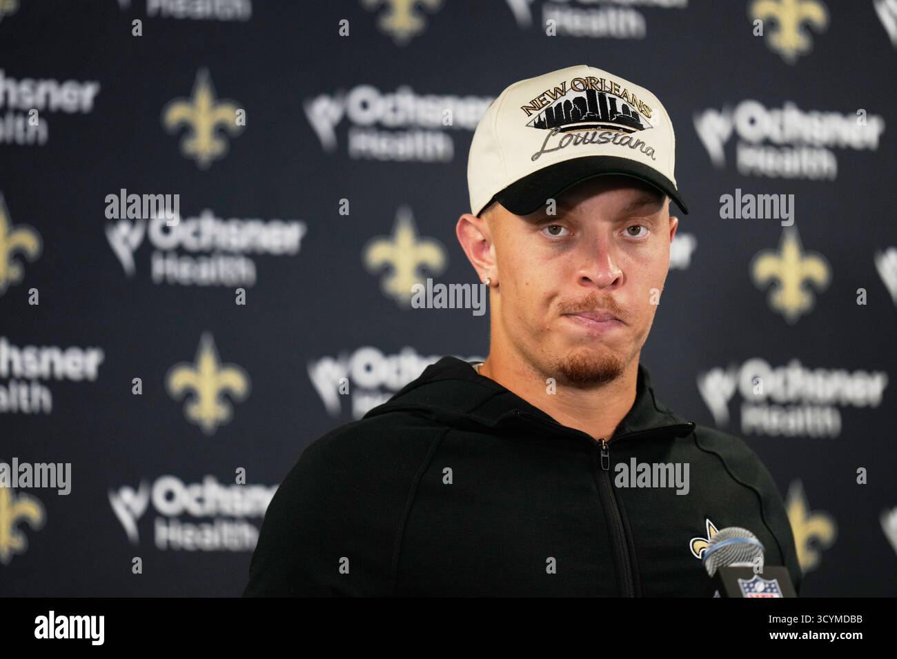 New Orleans Saints quarterback Spencer Rattler talks to reporters after ...