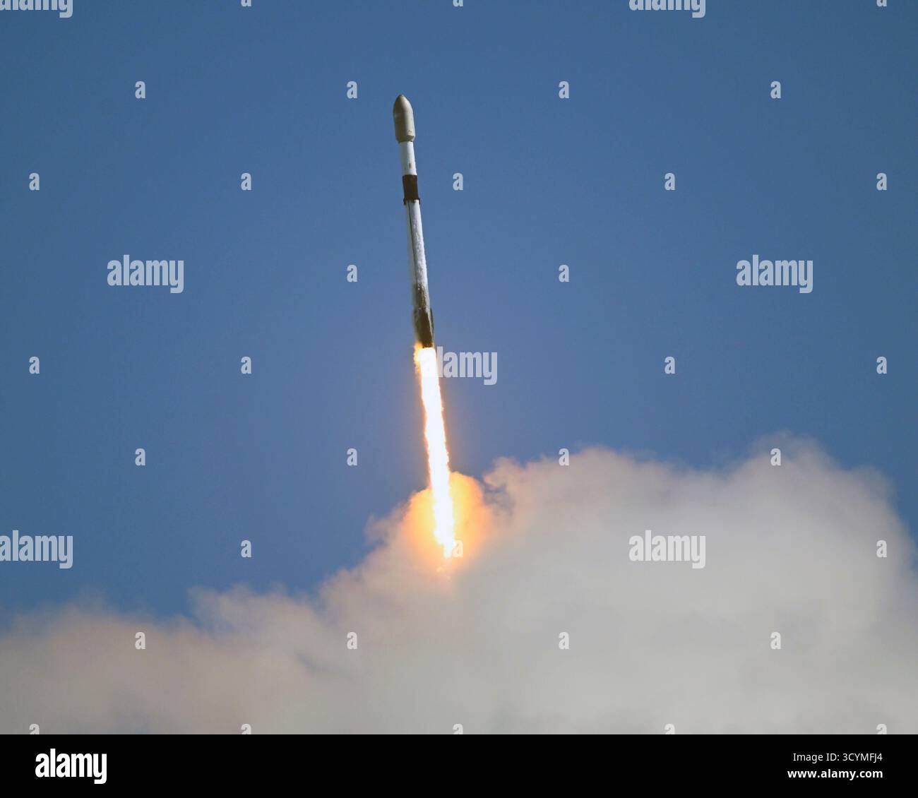 The SpaceX Falcon 9 rocket breaks through clouds as it launches 28 ...