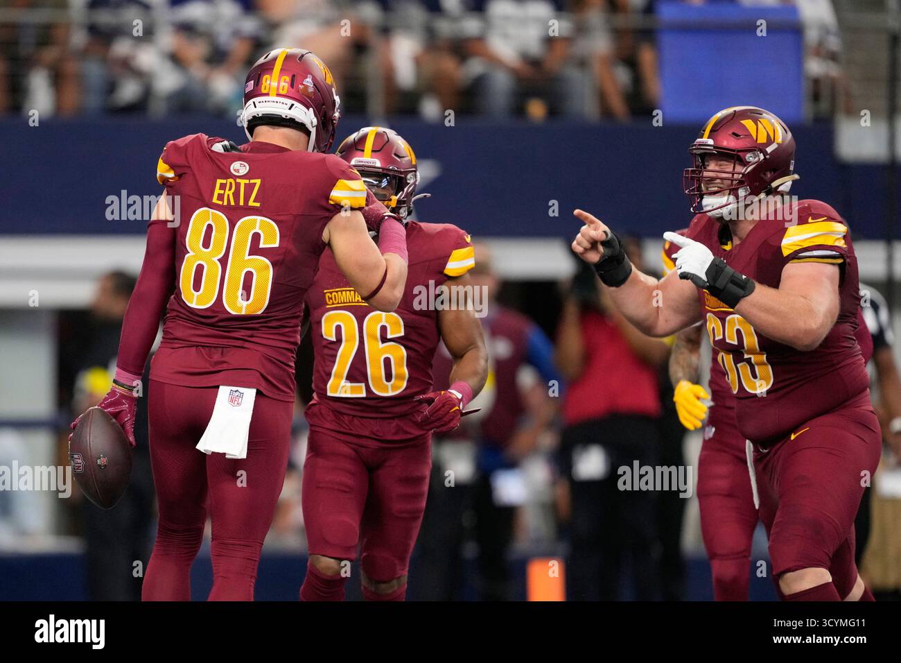 Washington Commanders tight end Zach Ertz (86) reacts with teammates ...