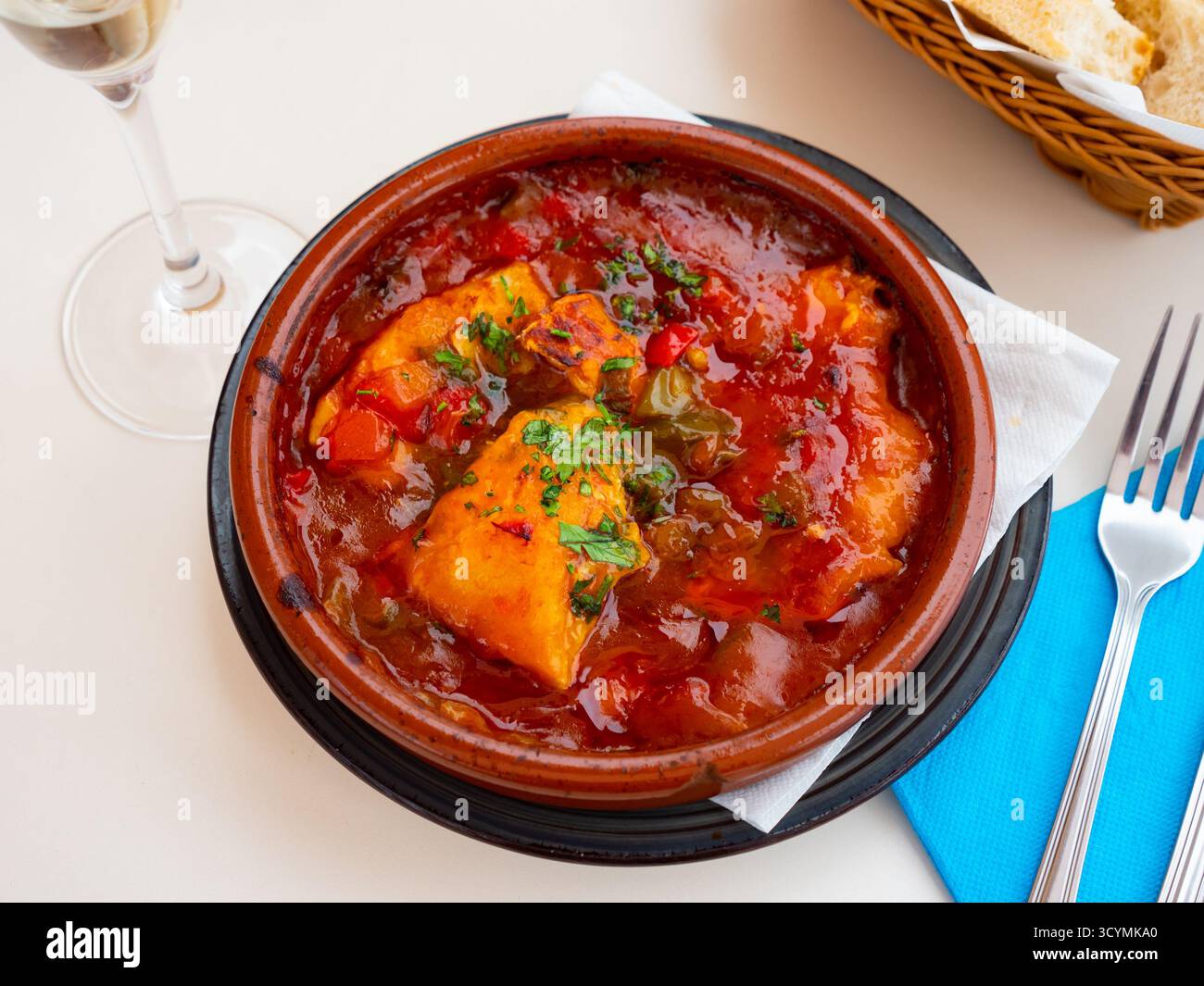 Fried cod with braised vegetables, spanish dish Stock Photo - Alamy