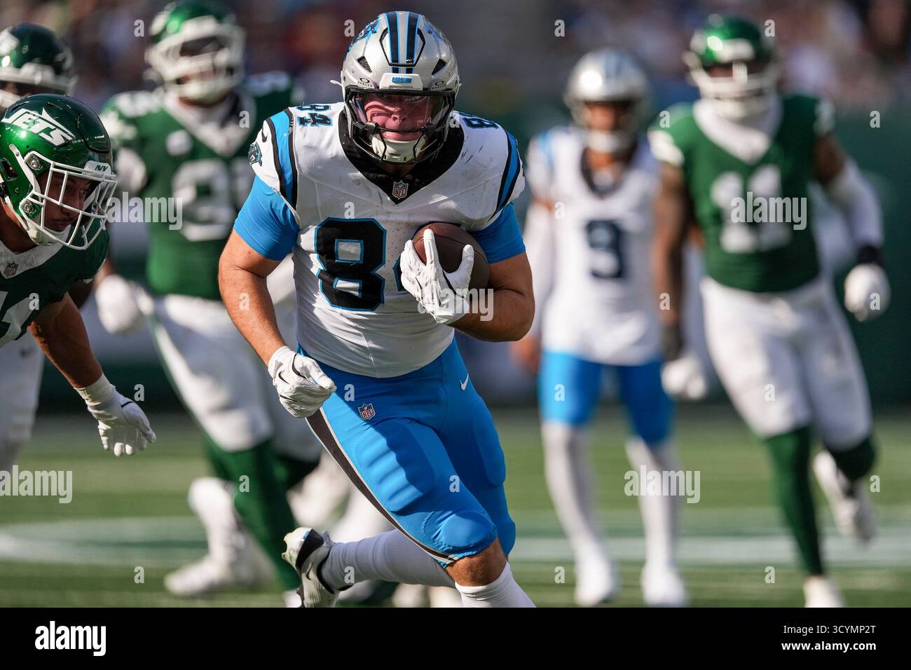 Carolina Panthers tight end Mitchell Evans (84) carries the ball ...