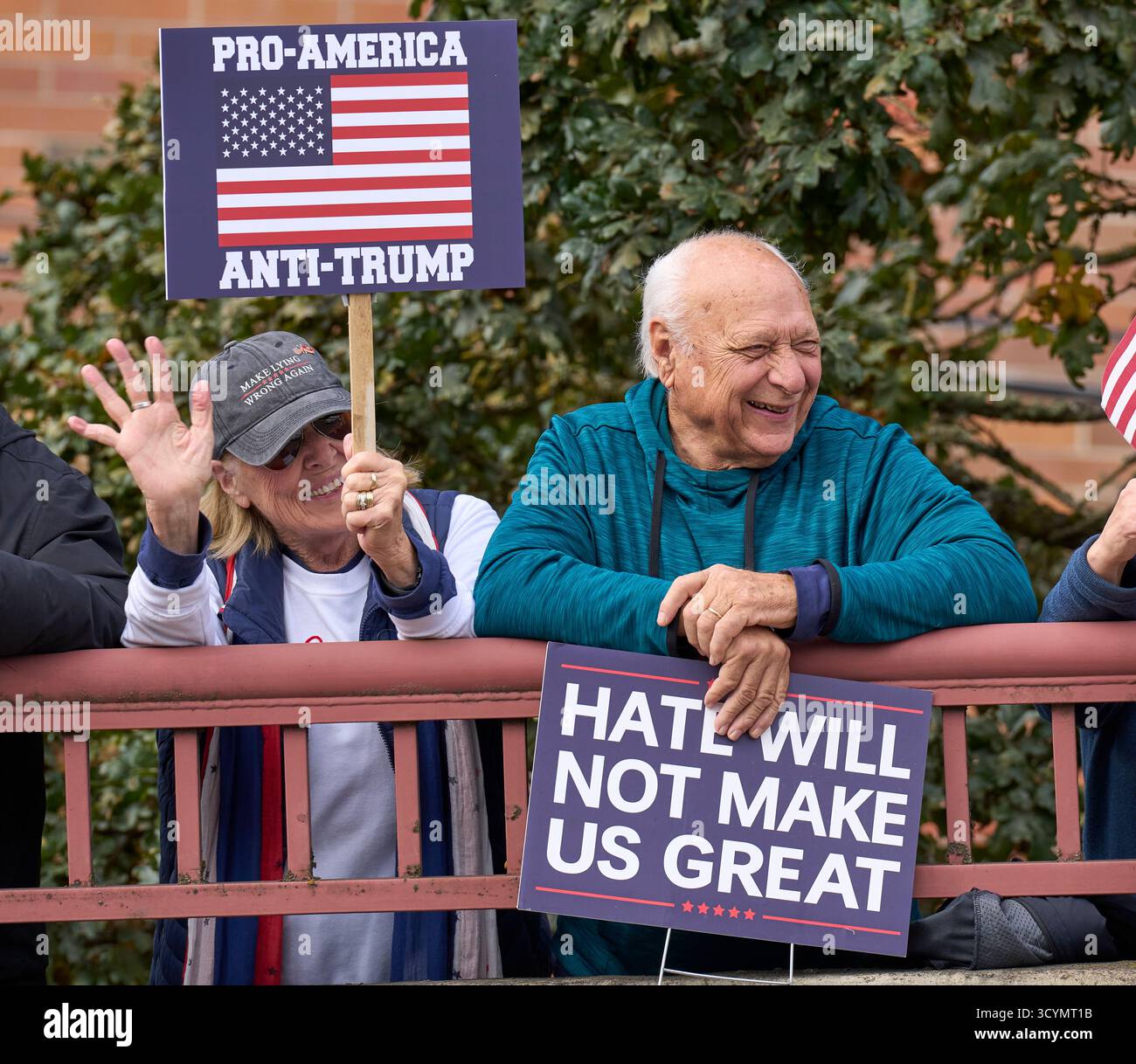 People hold signs at a No Kings demonstration in Eugene, Oregon, on ...
