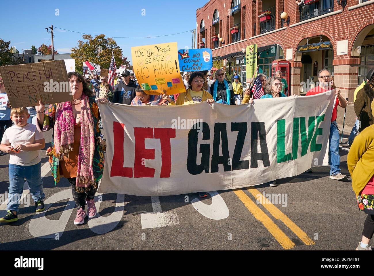 People carry a "Let Gaza Live" banner in a No Kings demonstration in ...