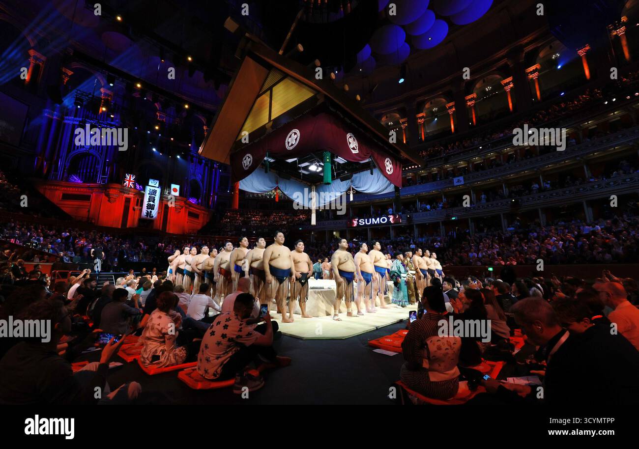 Sumo wrestlers attend the closing ceremony on the final day of the ...