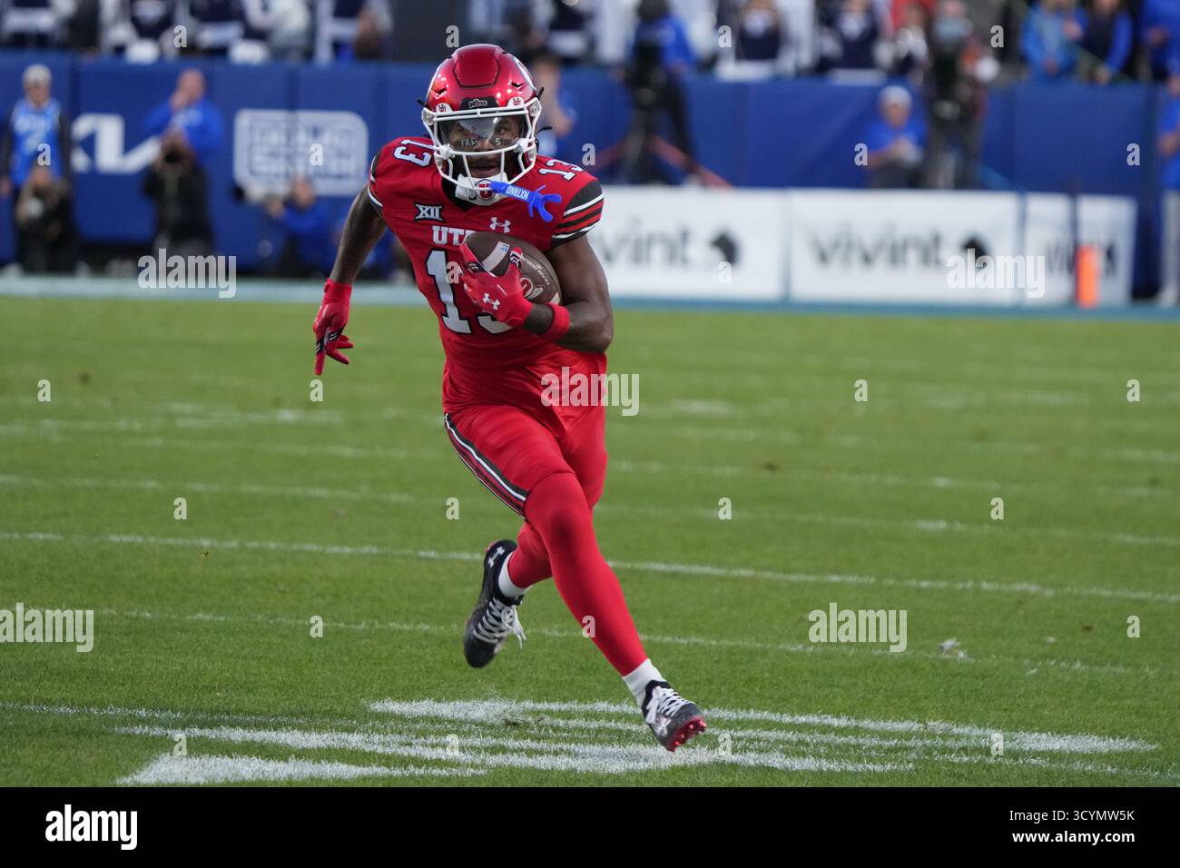 Utah running back Daniel Bray (13) runs the ball during the first half ...