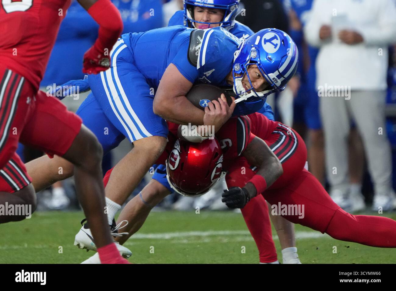 BYU quarterback Bear Bachmeier (47) is hit by Utah safety Tao Johnson ...