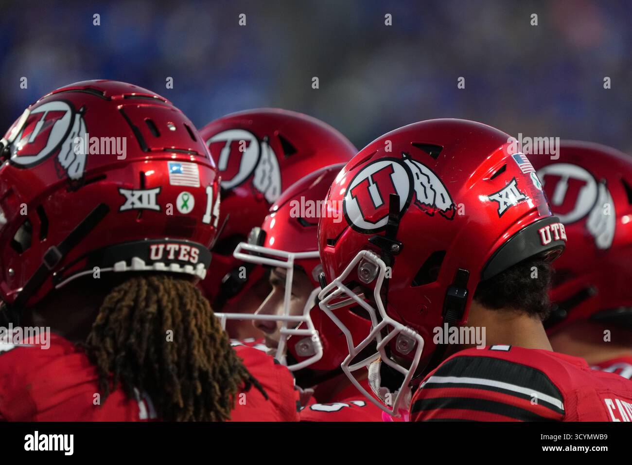 Utah players gather in a huddle during the first half of an NCAA ...