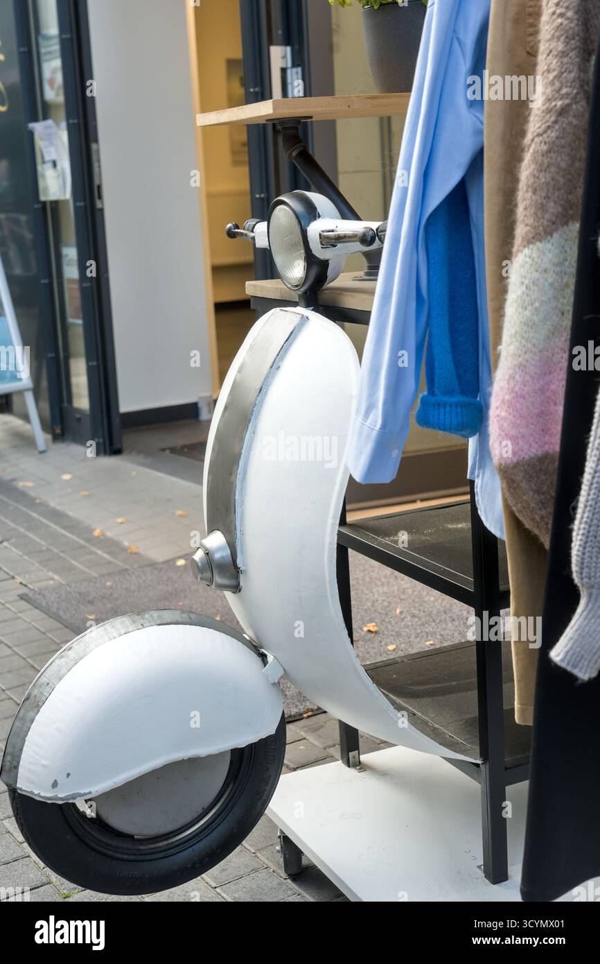 Decorated rolling shelf with handlebar, fender, and front wheel of a ...