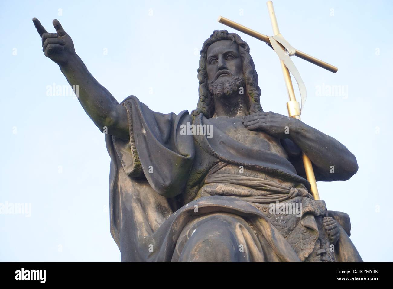 Frontal close up of a sandstone statue of merciful lord and savior ...