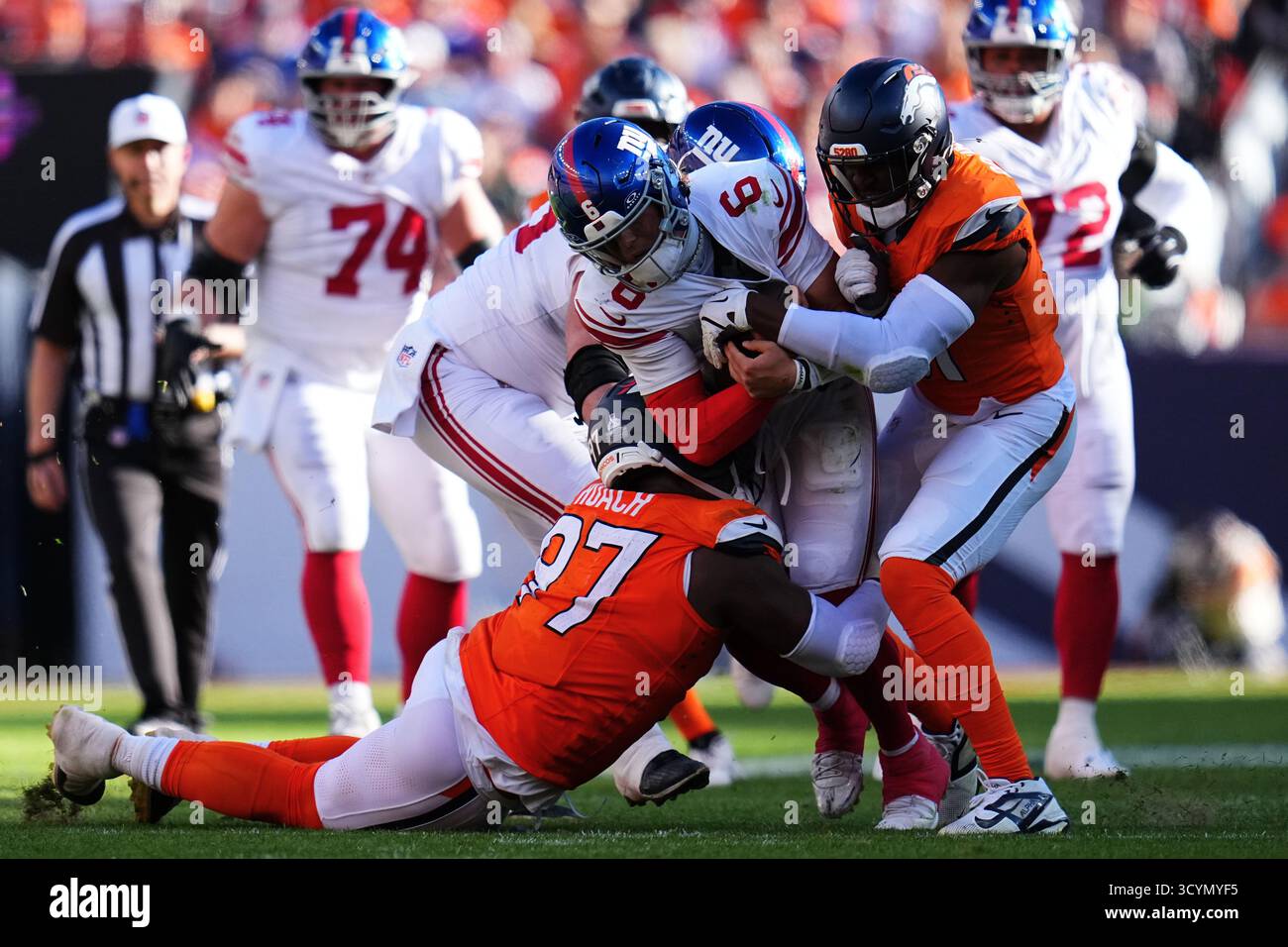 New York Giants quarterback Jaxson Dart (6) is tackled by Denver ...