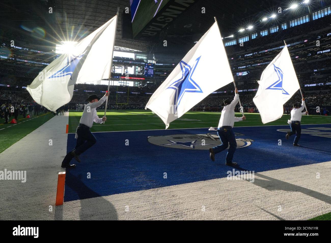 Flags are carried in the end zone after a touchdown by the Dallas ...