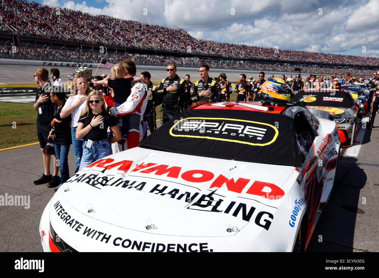 Drivers line pit road for the national anthem during a NASCAR Cup ...