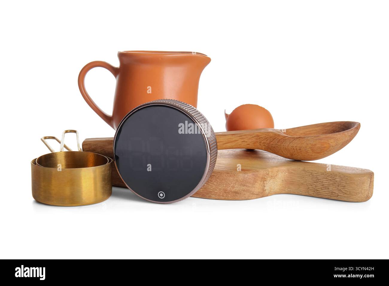 Modern kitchen timer, ingredients and utensils on white background ...