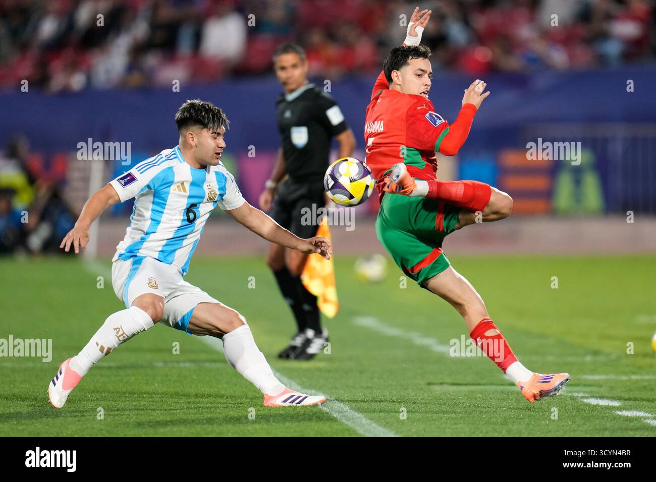 Argentina's Juan Villalba, left, and Morocco's Othmane Maamma vie for the ball during the FIFA U ...