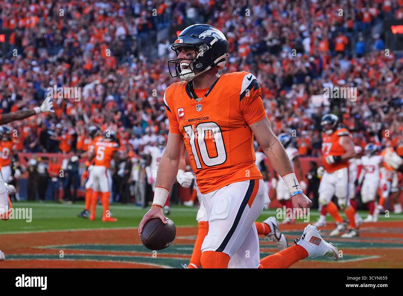 Denver Broncos quarterback Bo Nix (10) celebrates after scoring against ...