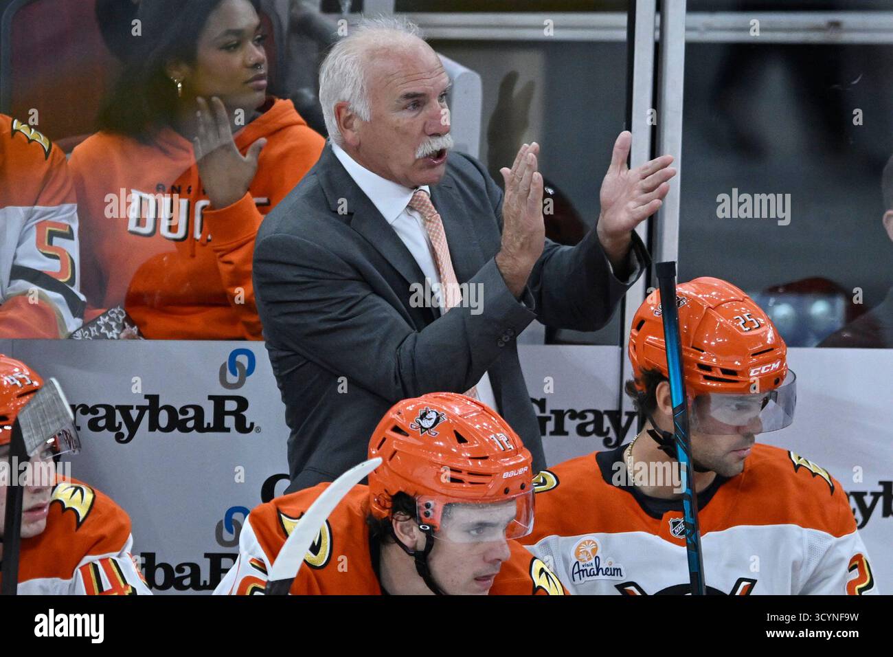 Anaheim Ducks head coach Joel Quenneville, center top, yells to his ...