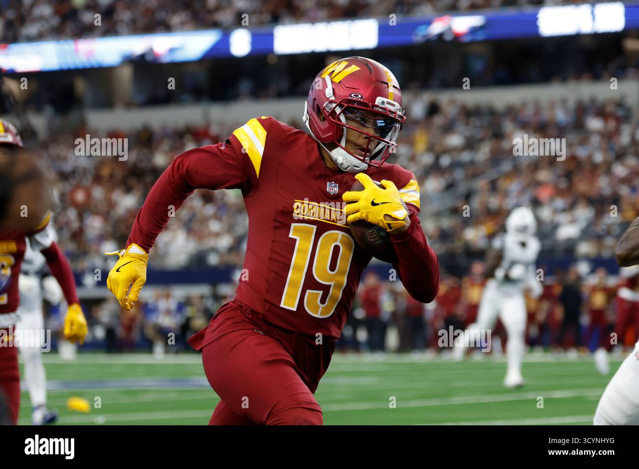Washington Commanders wide receiver Chris Moore (19) carries the ball ...