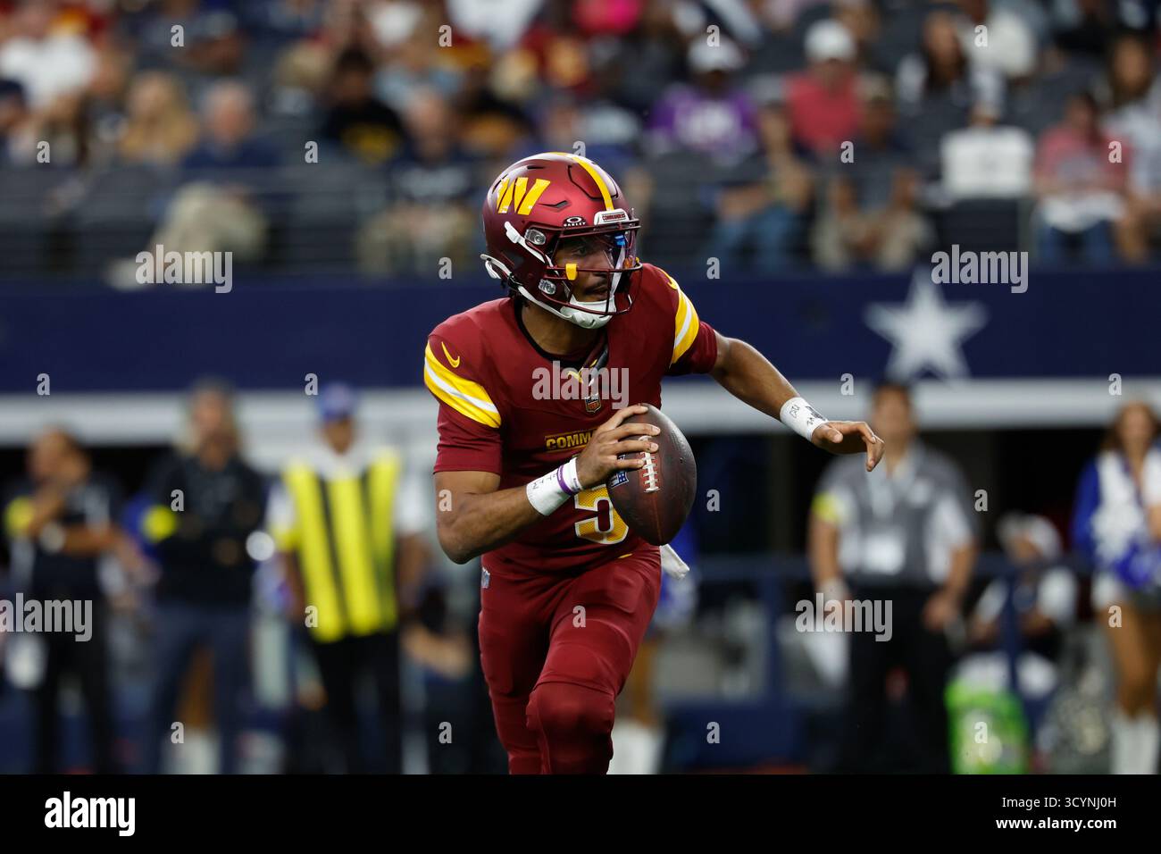 Washington Commanders quarterback Jayden Daniels (5) looks to pass ...