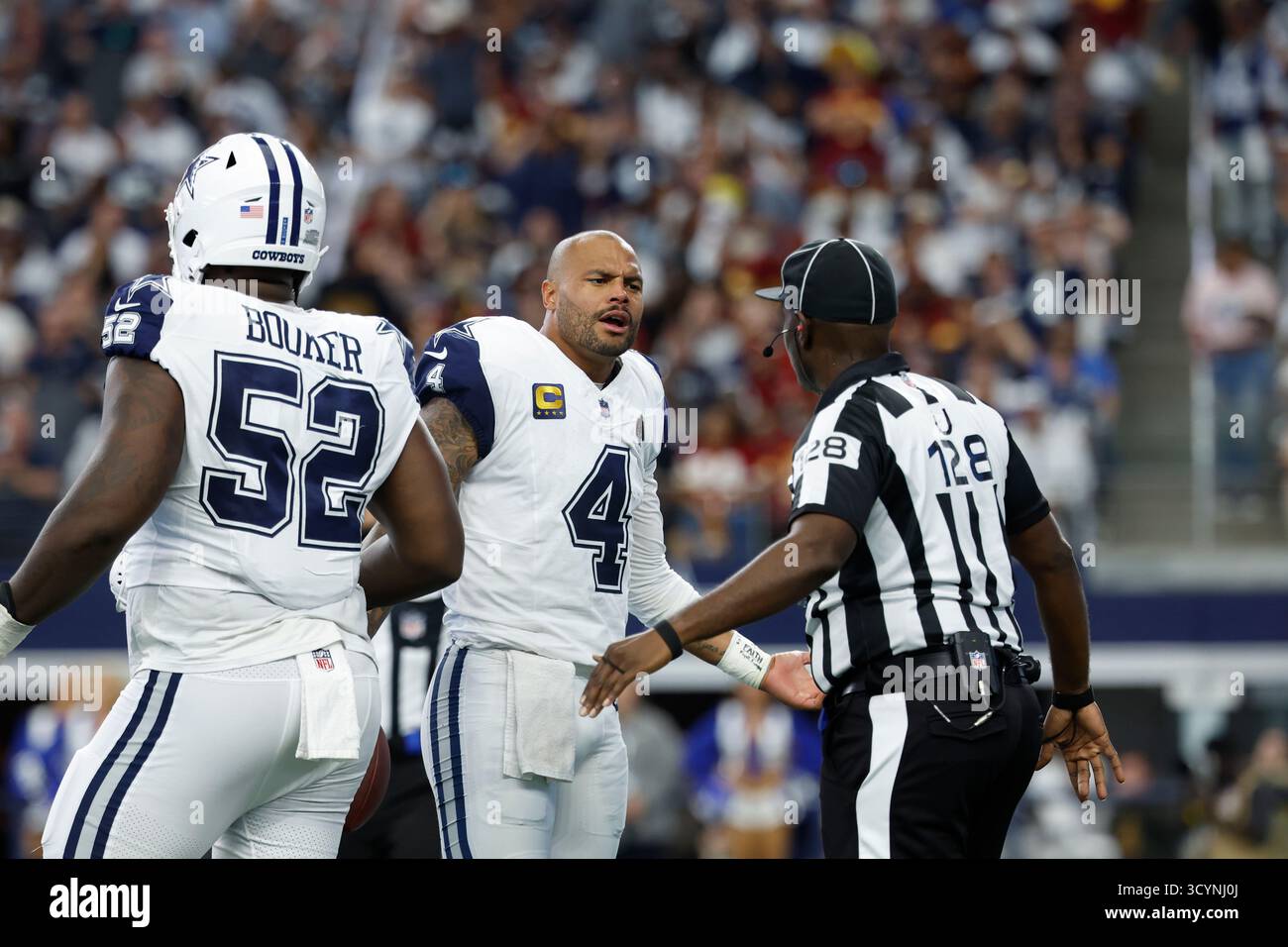 Dallas Cowboys quarterback Dak Prescott (4) loses his helmet during a ...