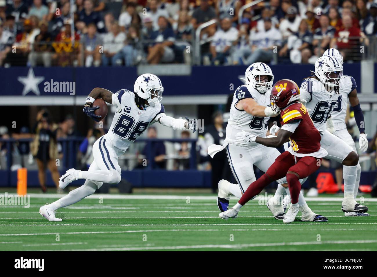 Dallas Cowboys wide receiver CeeDee Lamb (88) follows blockers after a ...
