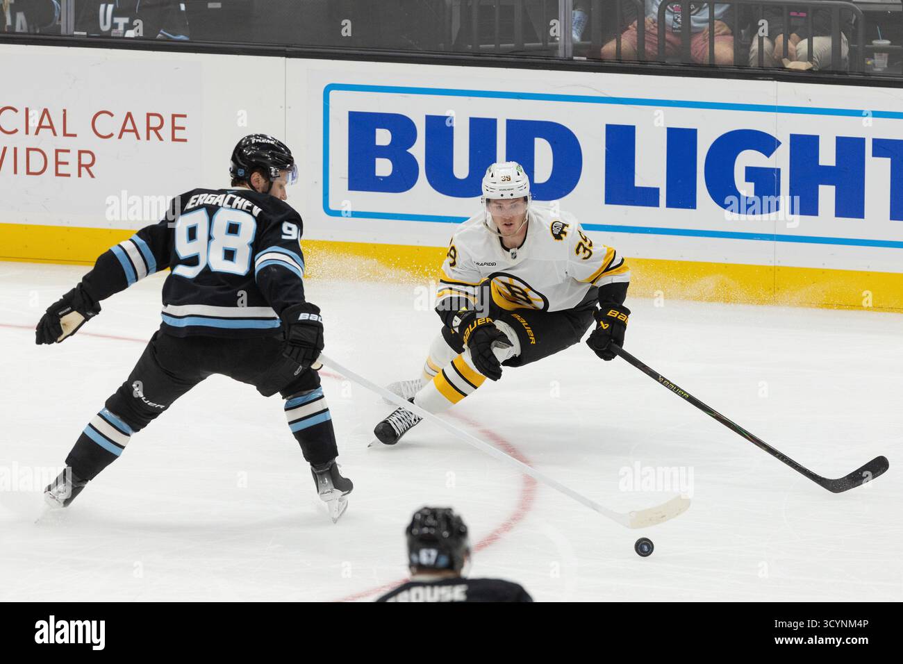Utah Mammoth defense Mikhail Sergachev (98) goes after the puck against ...