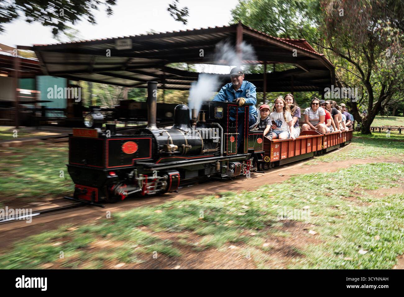 Johannesburg, South Africa. 19th Oct, 2025. Visitors ride on a model ...