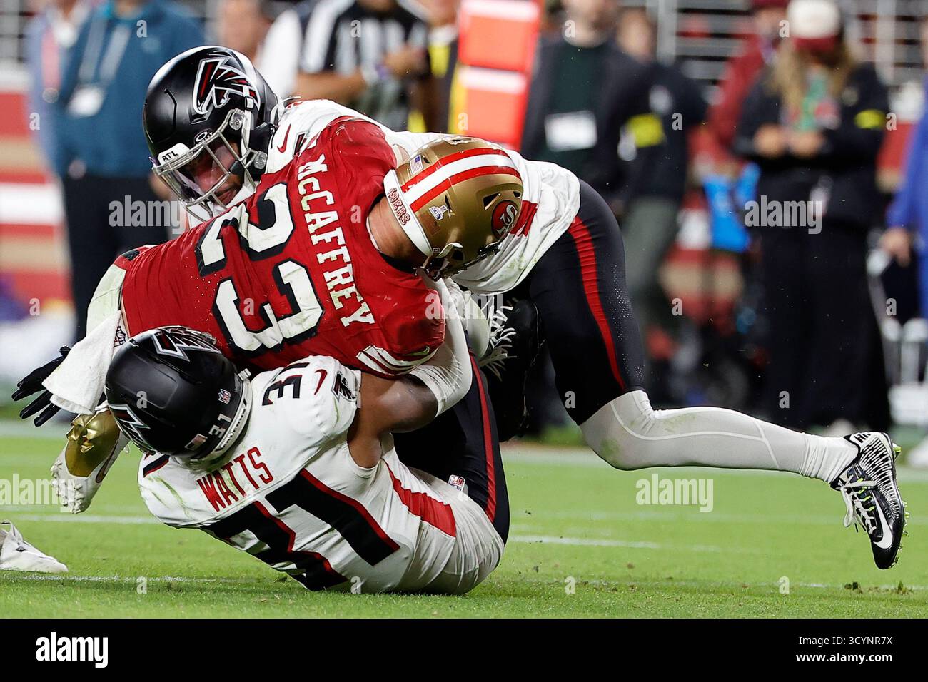 Atlanta Falcons safety Xavier Watts (31) tackles San Francisco 49ers running back Christian ...