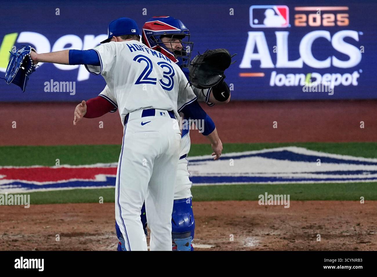 Toronto Blue Jays pitcher Jeff Hoffman (23) embraces catcher Alejandro ...